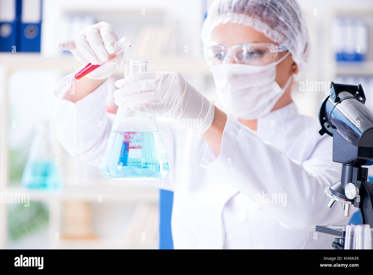 Female scientist researcher conducting an experiment in a laboratory ...