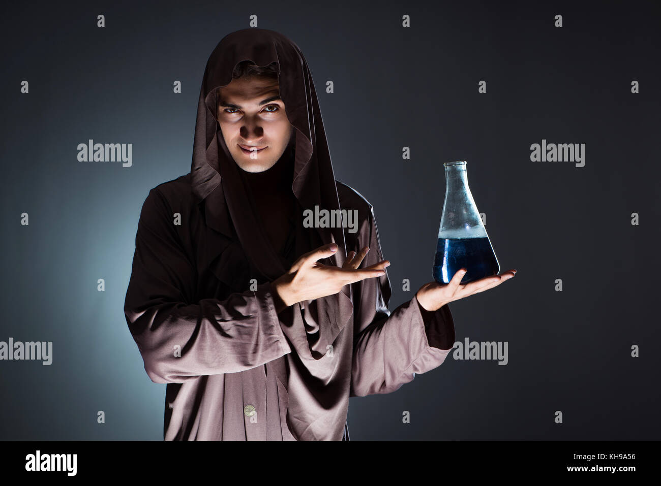 Alchemist doing experiments in alchemy concept Stock Photo - Alamy