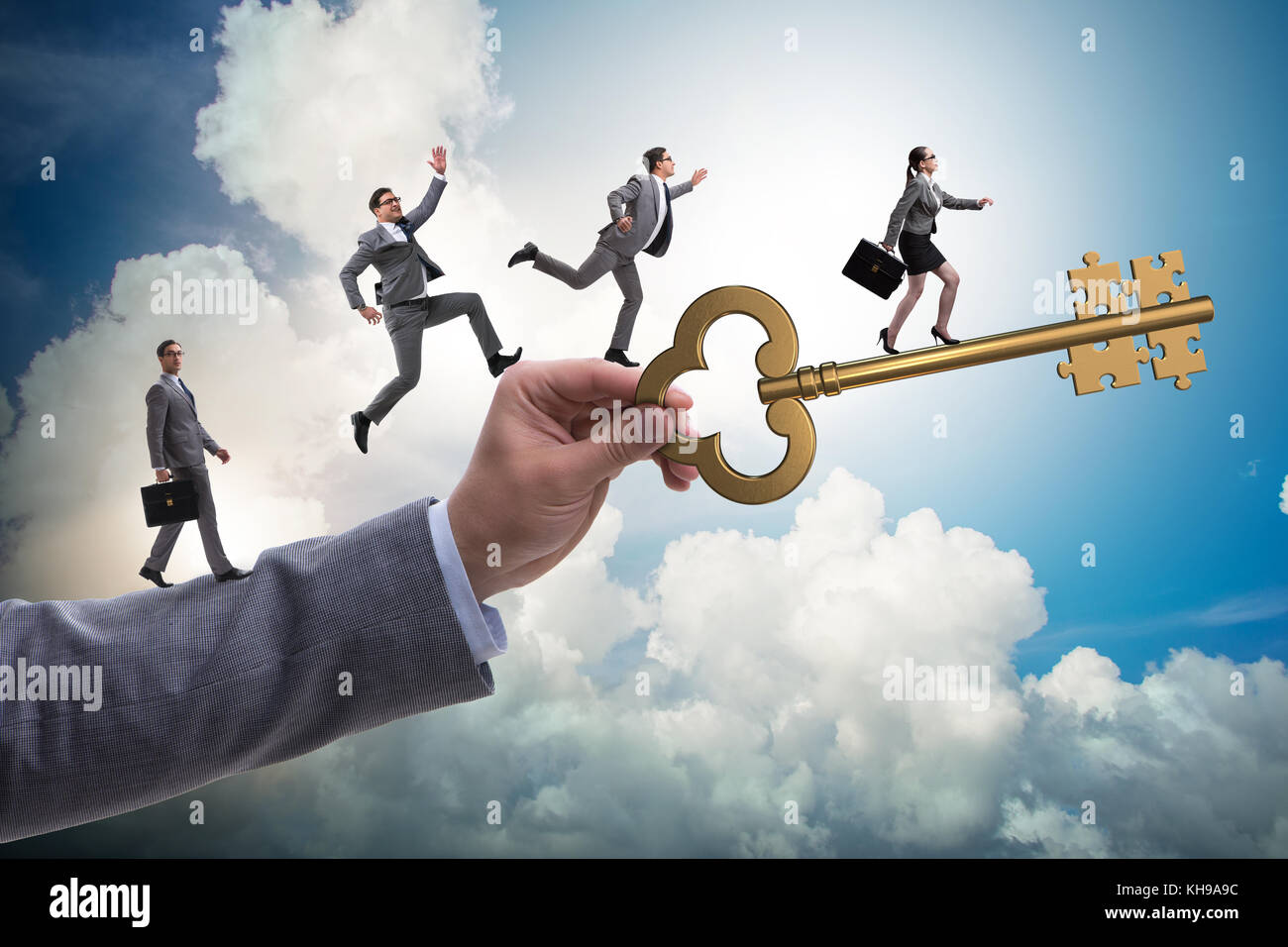 Business people chasing each other towards key to success Stock Photo ...