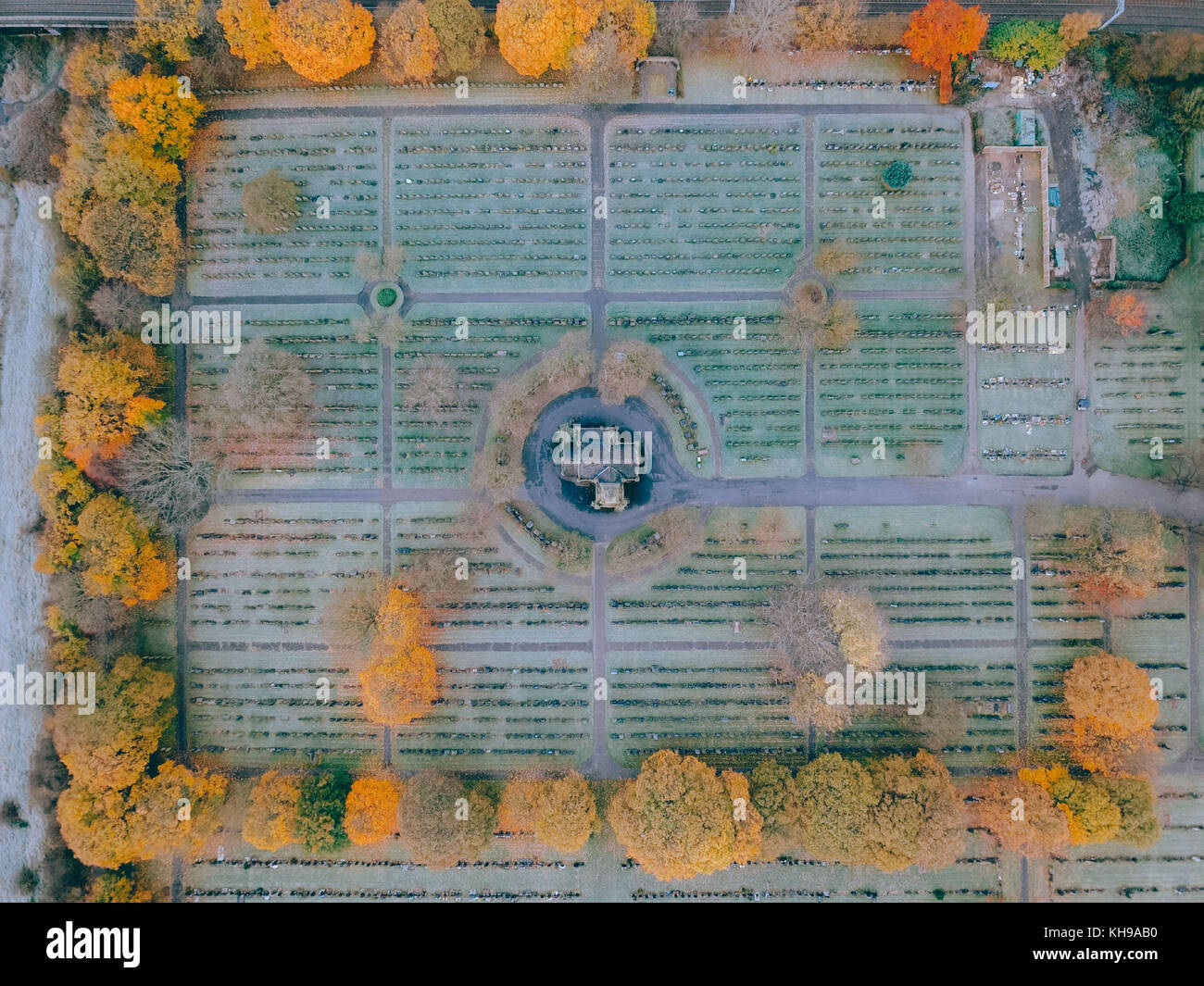 Aerial drone view of a cemetery with trees and train line Stock Photo ...
