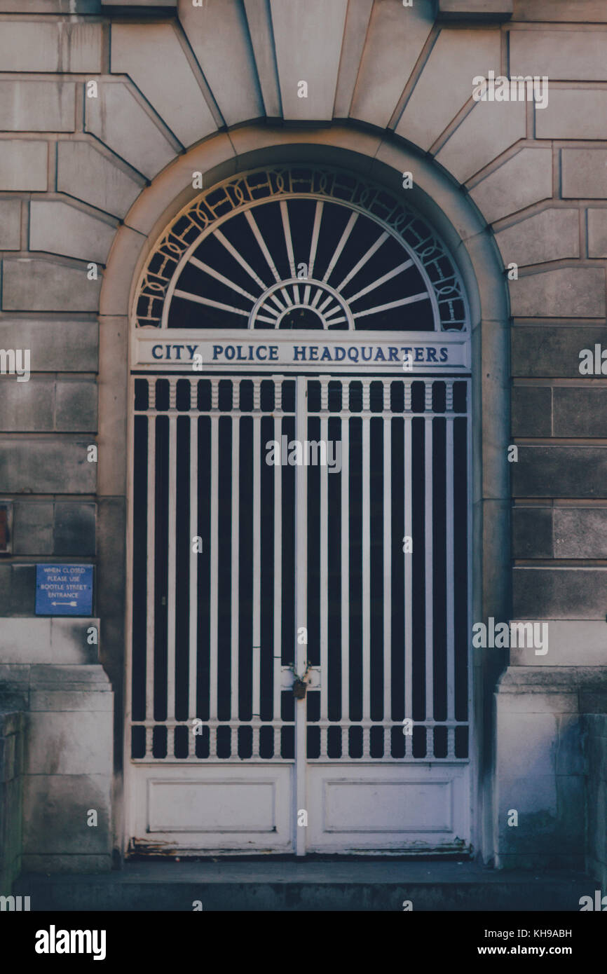 city police headquarters old sign and metal gate in city centre Stock ...