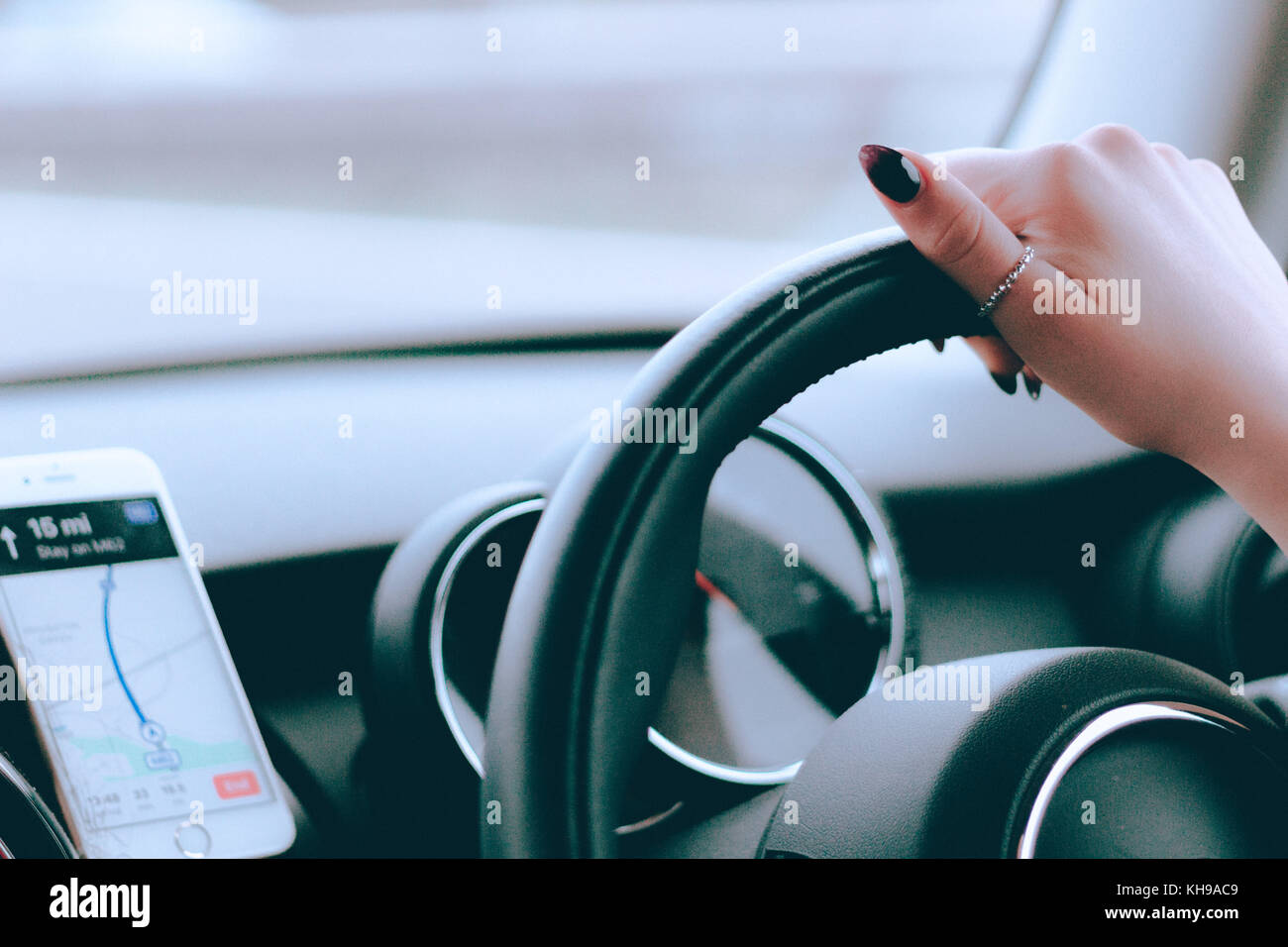 woman driving a car with sat nav showing directions Stock Photo - Alamy
