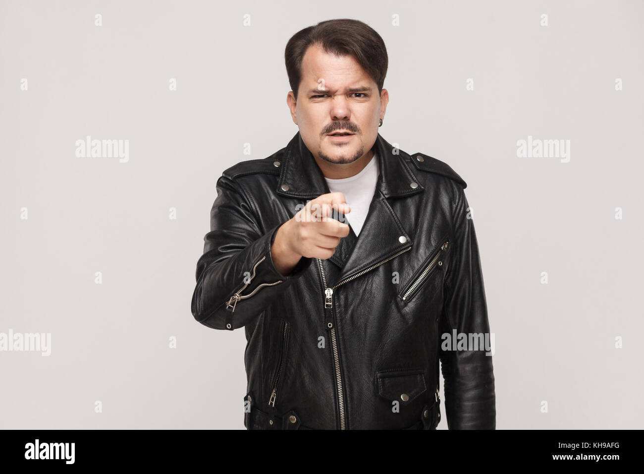 Anger adult man pointing finger at camera. Studio shot, isolated on ...