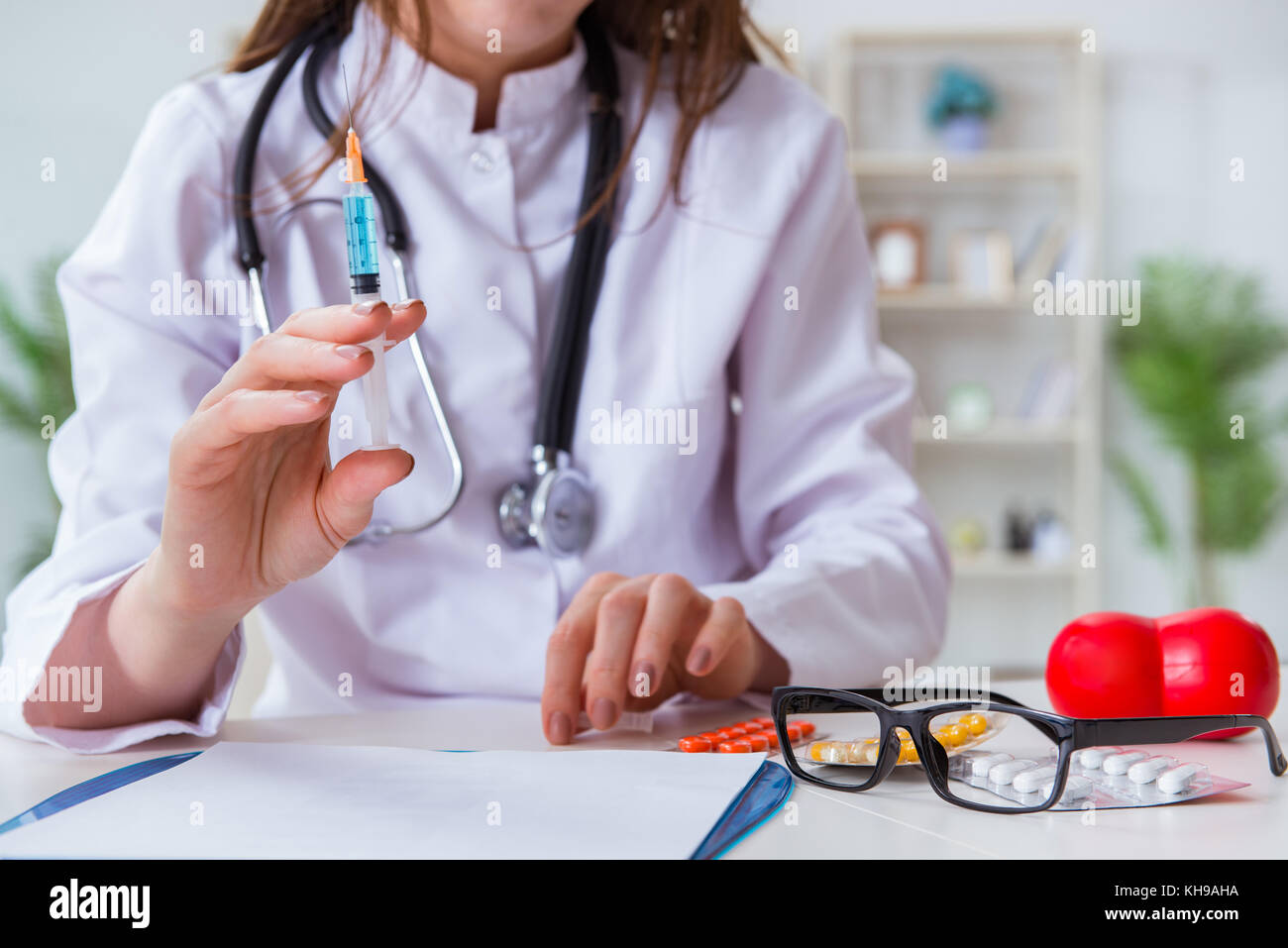 Doctor with syringe in the hospital Stock Photo - Alamy