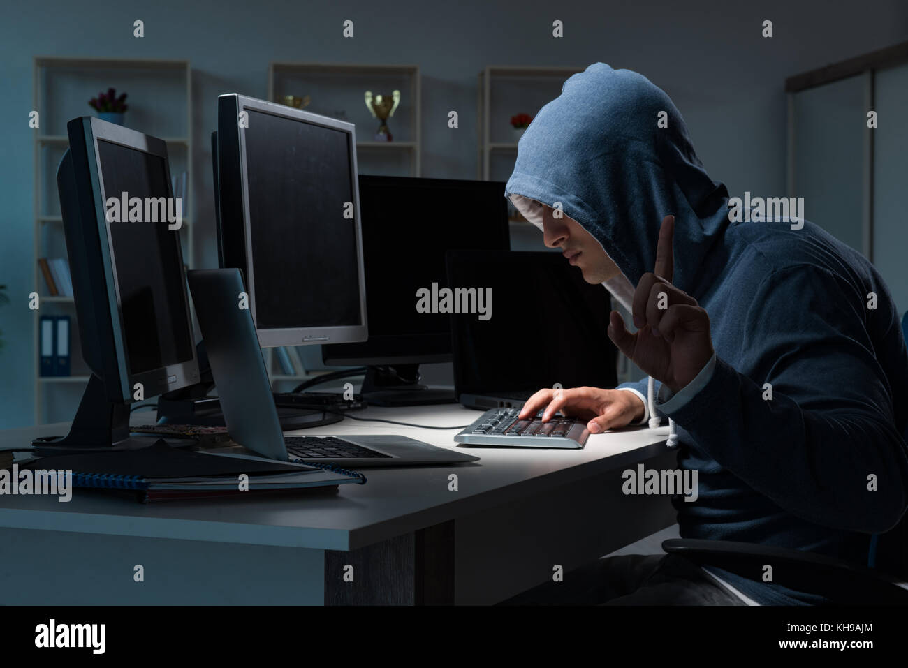 Hacker hacking computer at night Stock Photo - Alamy