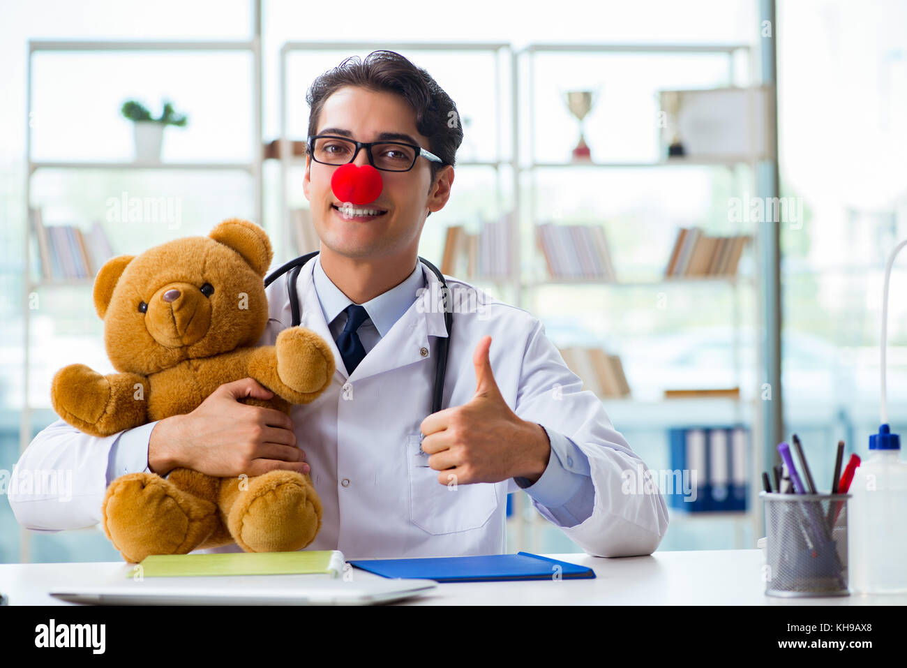 Funny pediatrician with toy in the hospital clinic Stock Photo - Alamy
