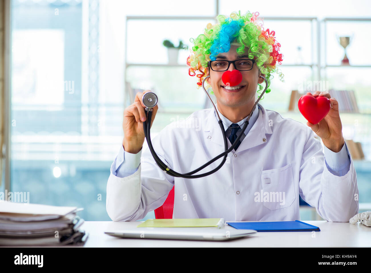 Child cardiologist with stethoscope and red heart Stock Photo - Alamy