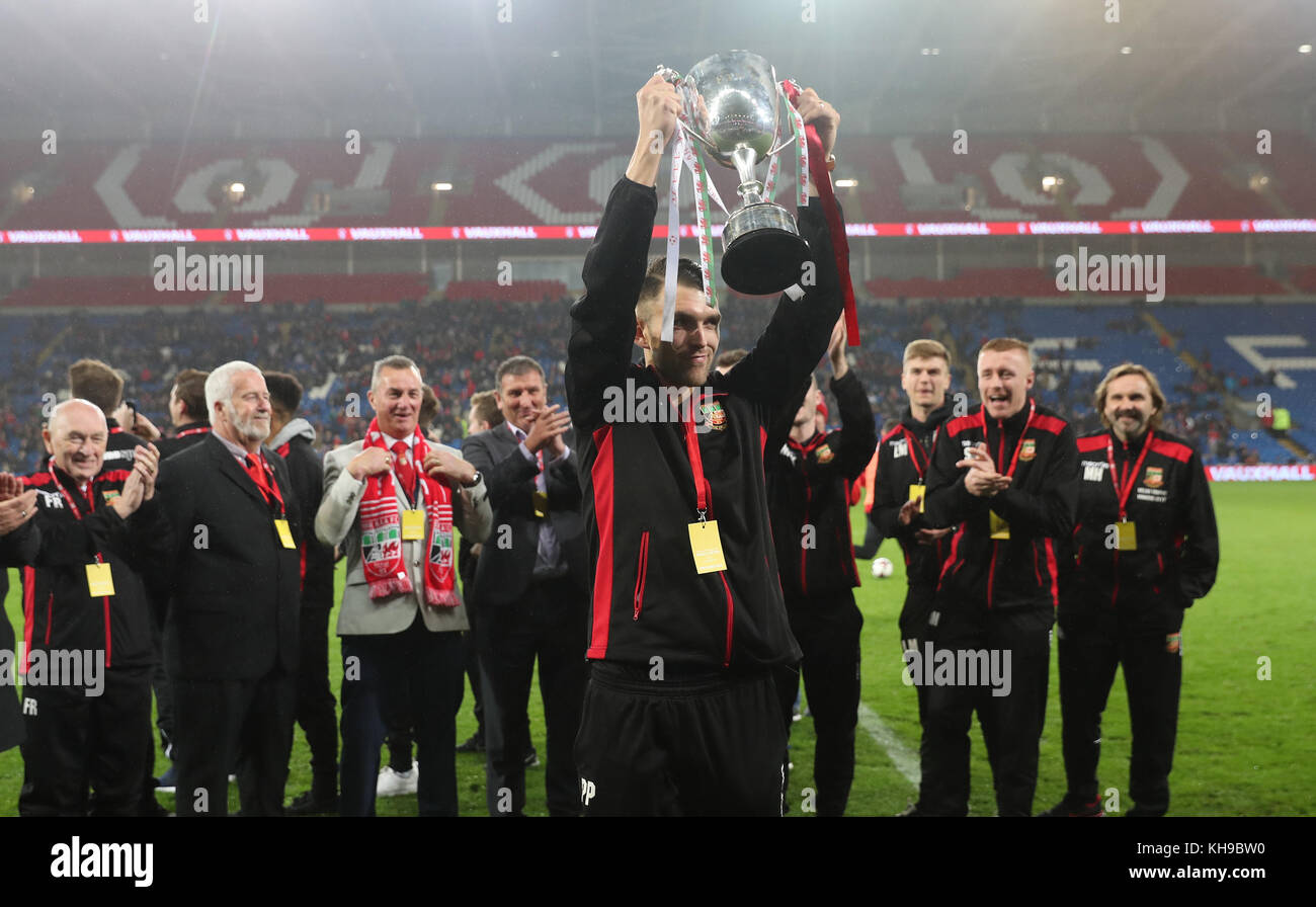 Chirk AAA receive the Welsh Trophy during the International Friendly ...