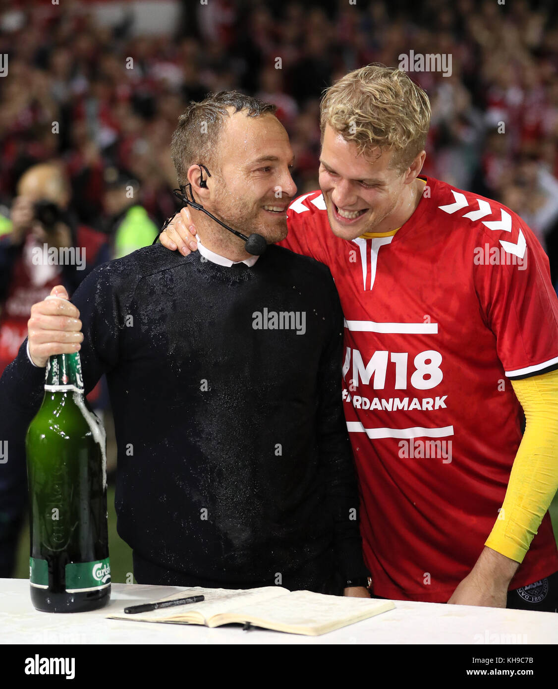 Former footballer and TV Presenter Lars Jacobsen (left) reacts after ...