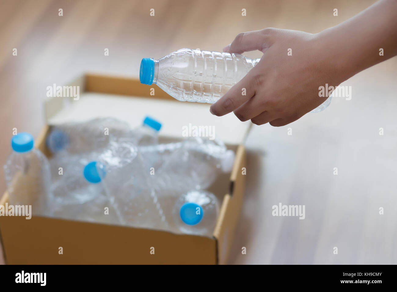man hand putting plastic reuse for recycling concept environmental ...