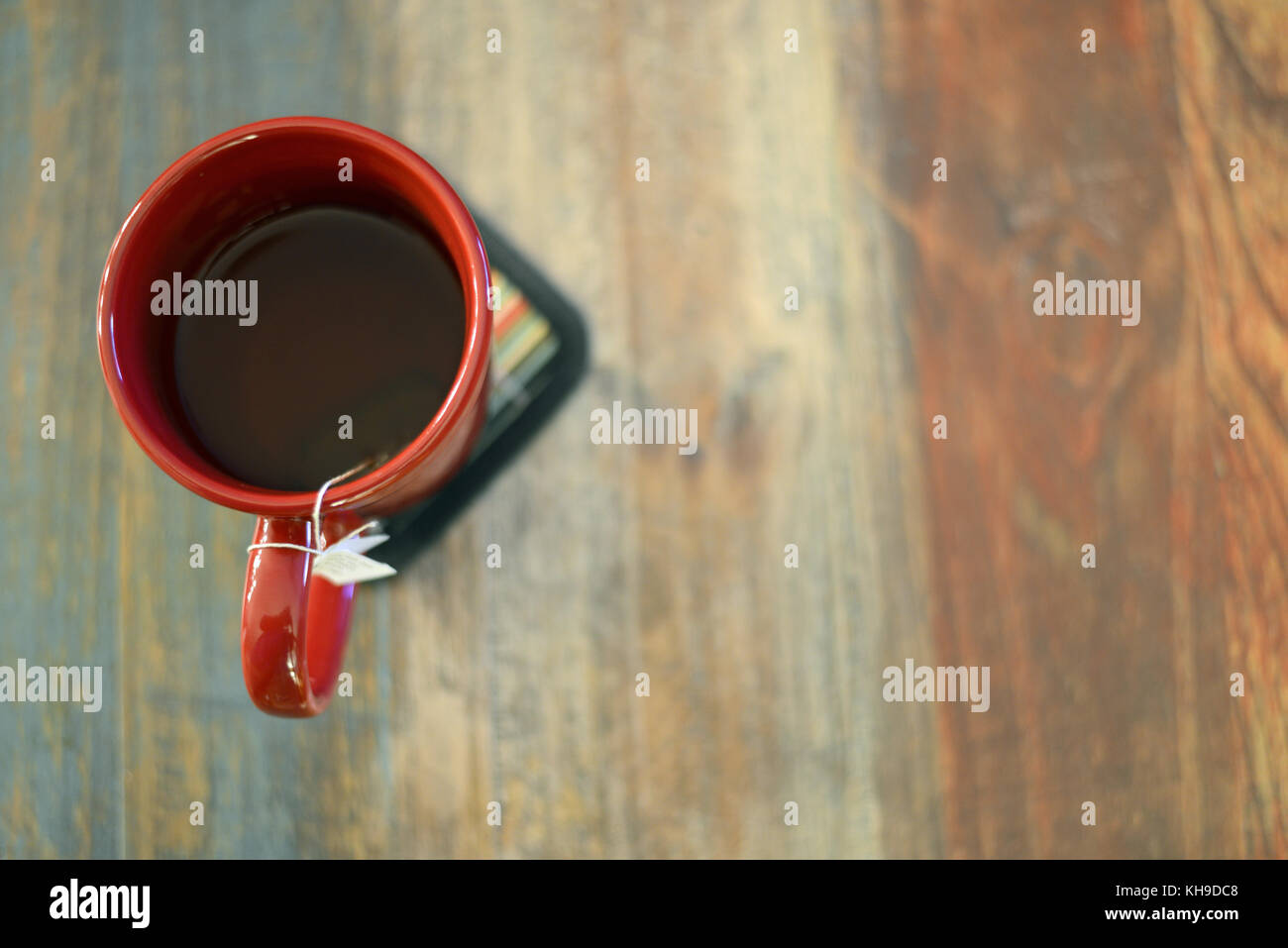Warm cup of tea on end table with blank space hi-res stock photography ...
