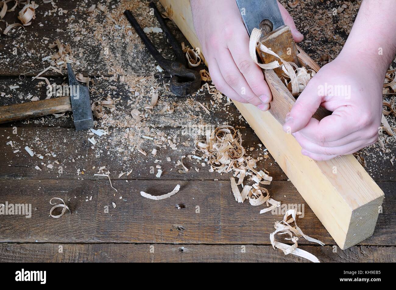 Carpenter working wood on the workbench carpentry Stock Photo - Alamy