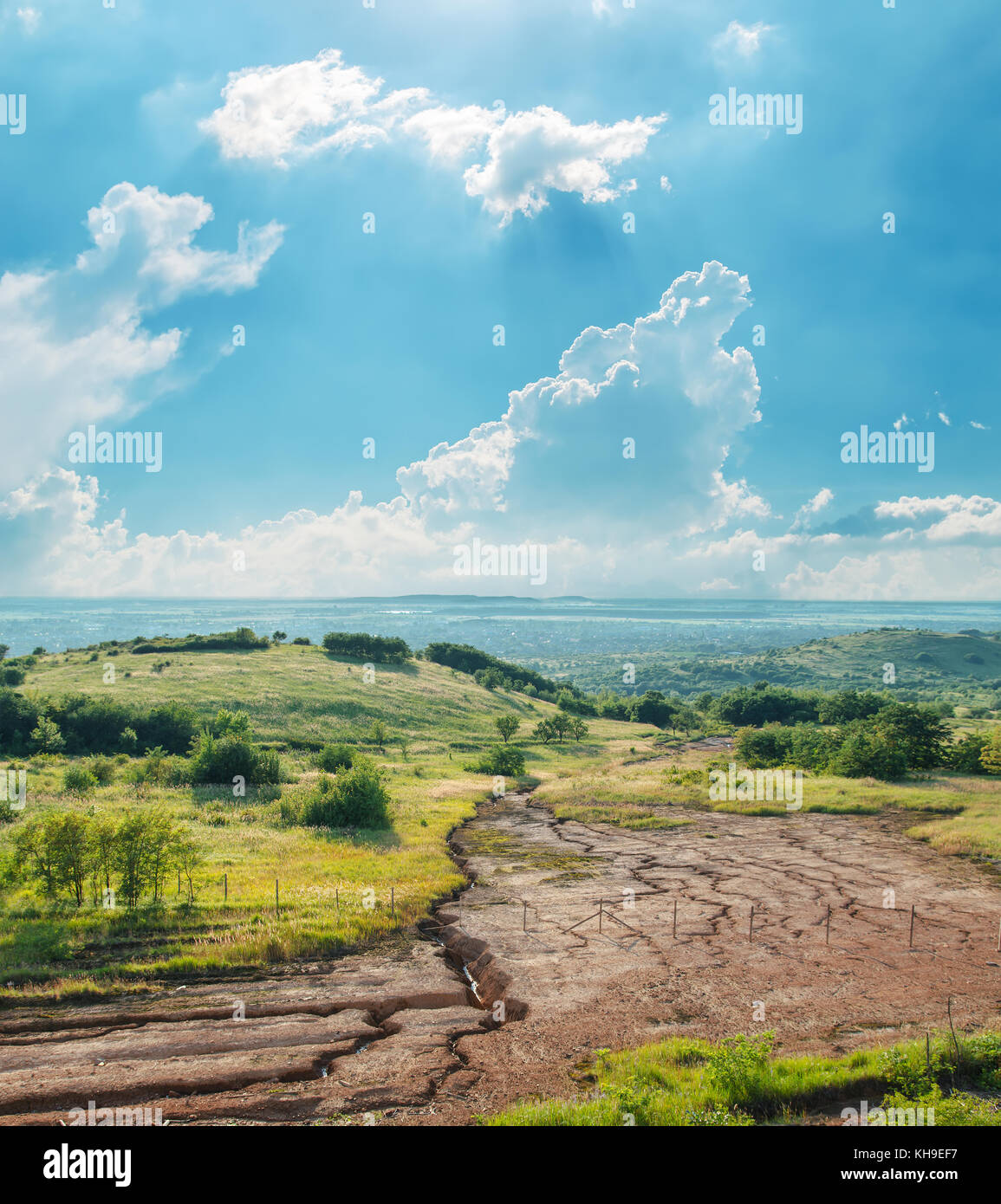 cloudy sky over drought earth Stock Photo - Alamy