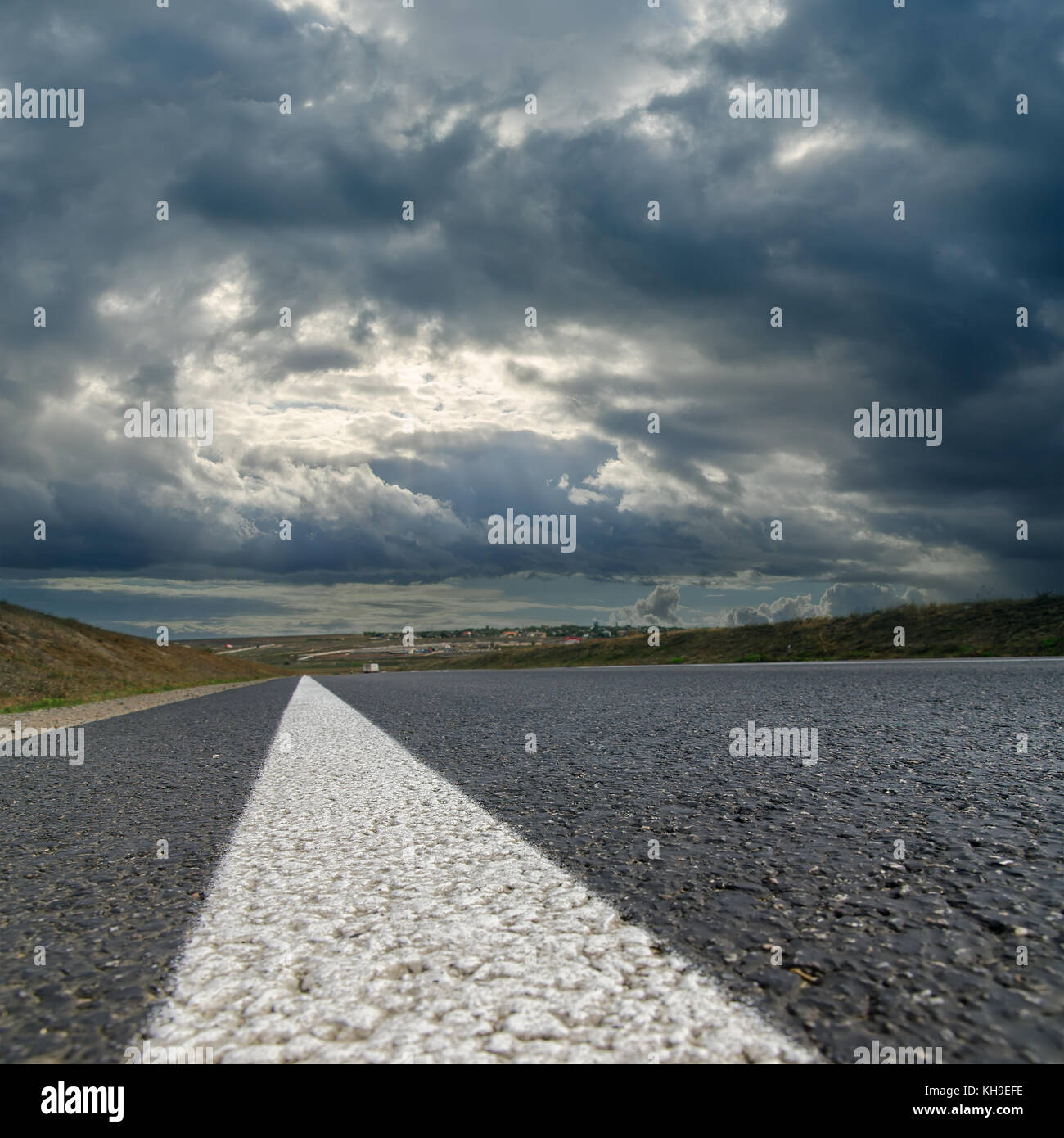 dramatic sky over asphalt road Stock Photo - Alamy