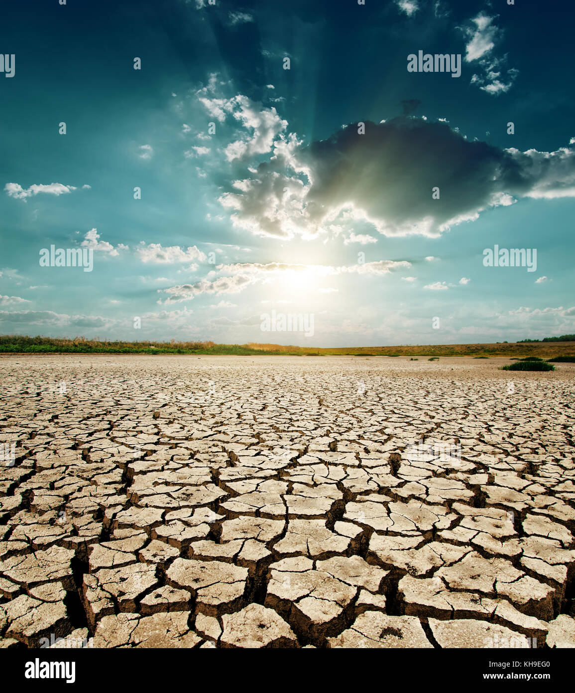 dramatic sunset over drought land Stock Photo - Alamy