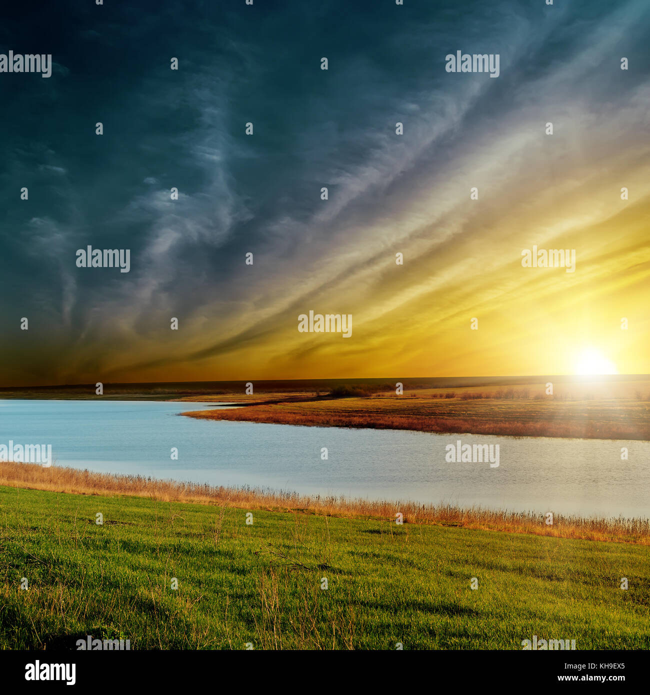 dramatic sunset over river Stock Photo - Alamy