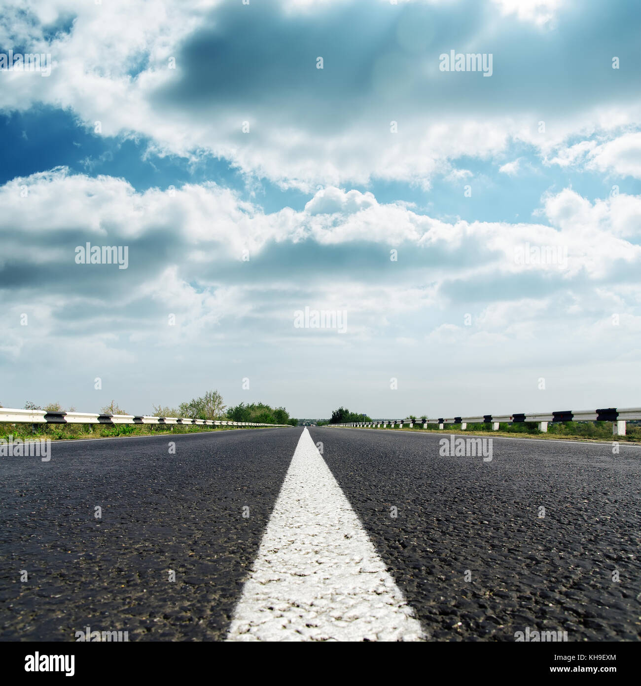 dramatic sky over asphalt road Stock Photo - Alamy