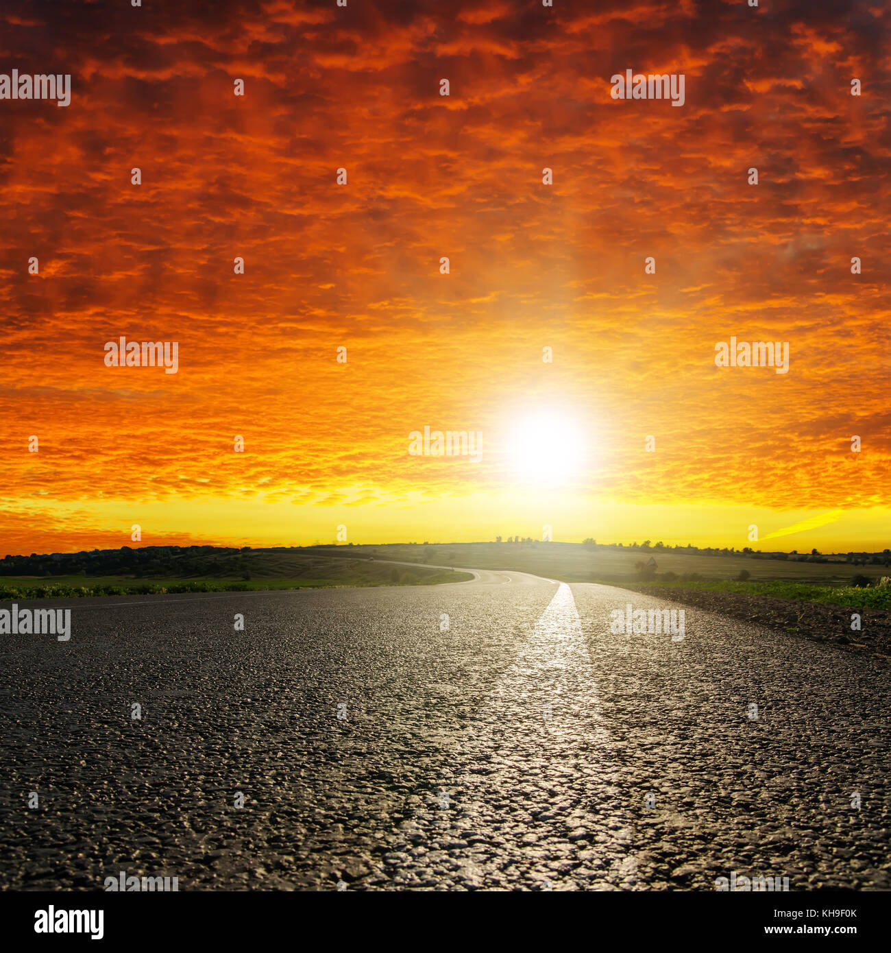 red dramatic sunset over asphalt road Stock Photo - Alamy