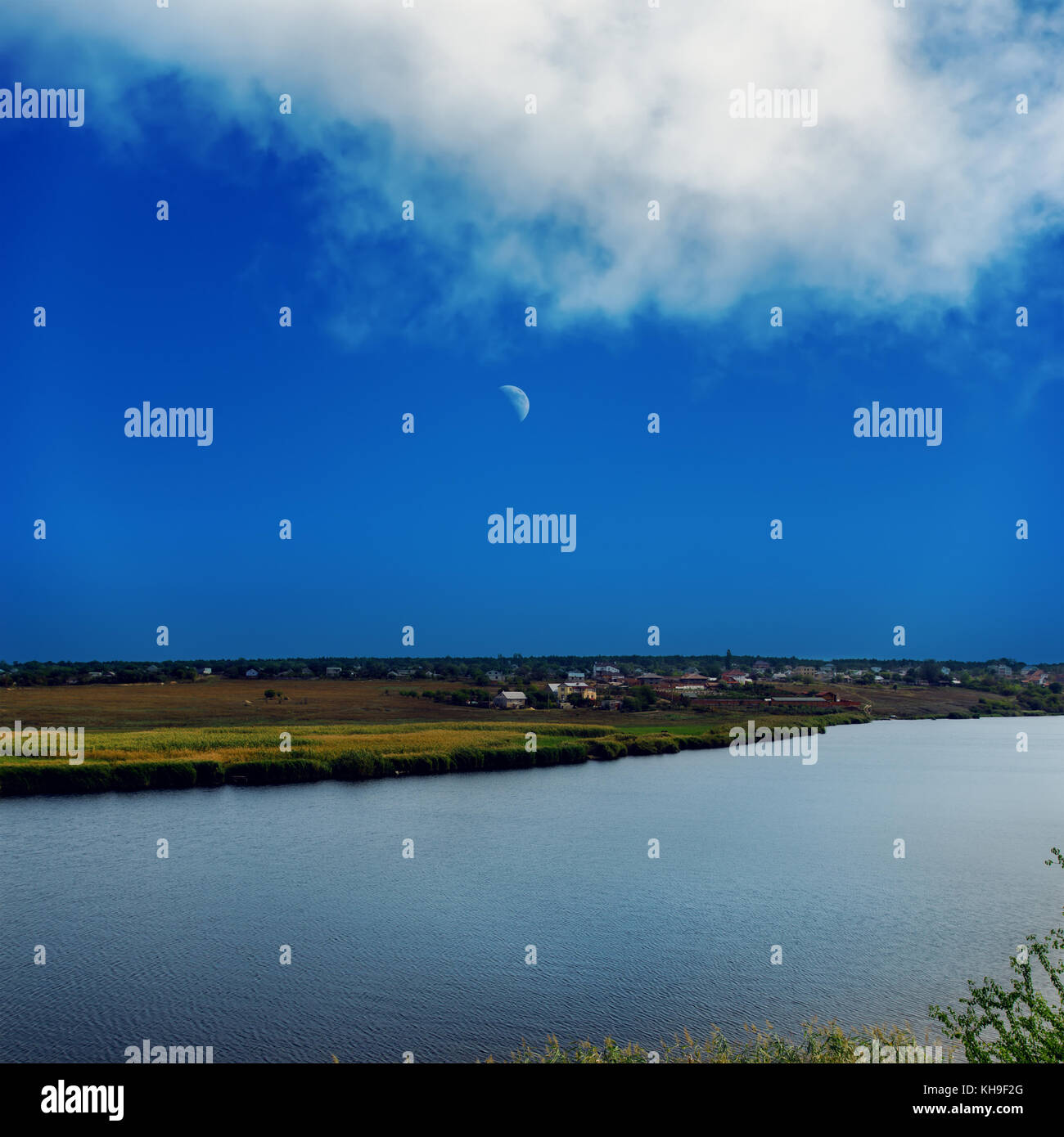river and deep blue sky with moon Stock Photo - Alamy