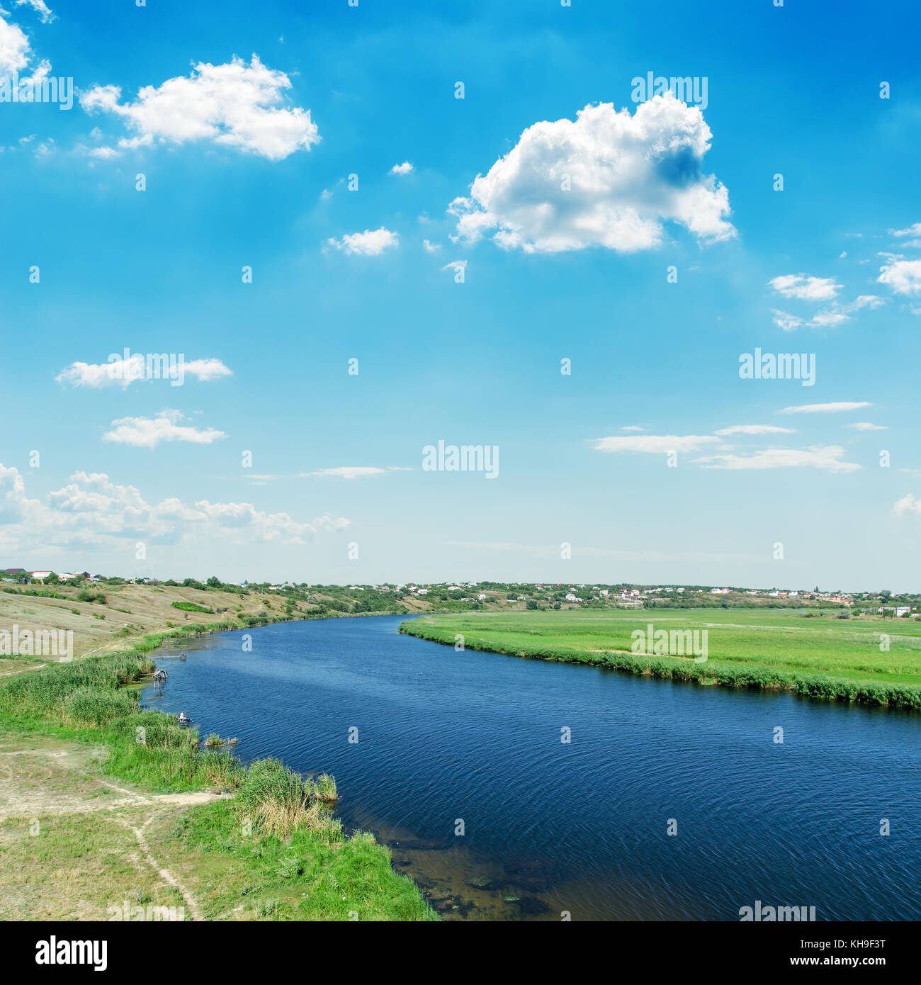 river and blue sky with clouds Stock Photo - Alamy