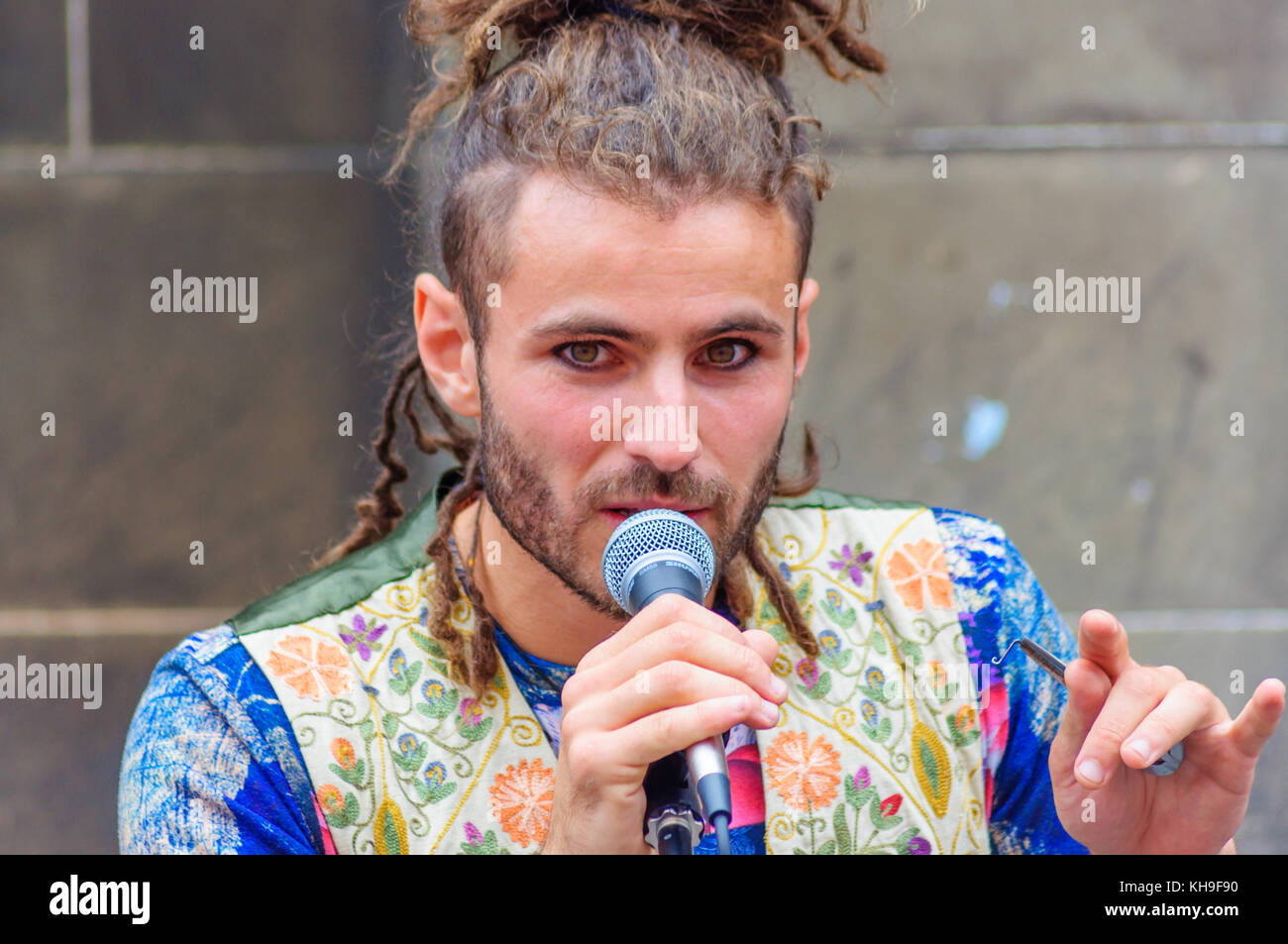 Closeup of a male singer performing on the Royal Mile during the ...