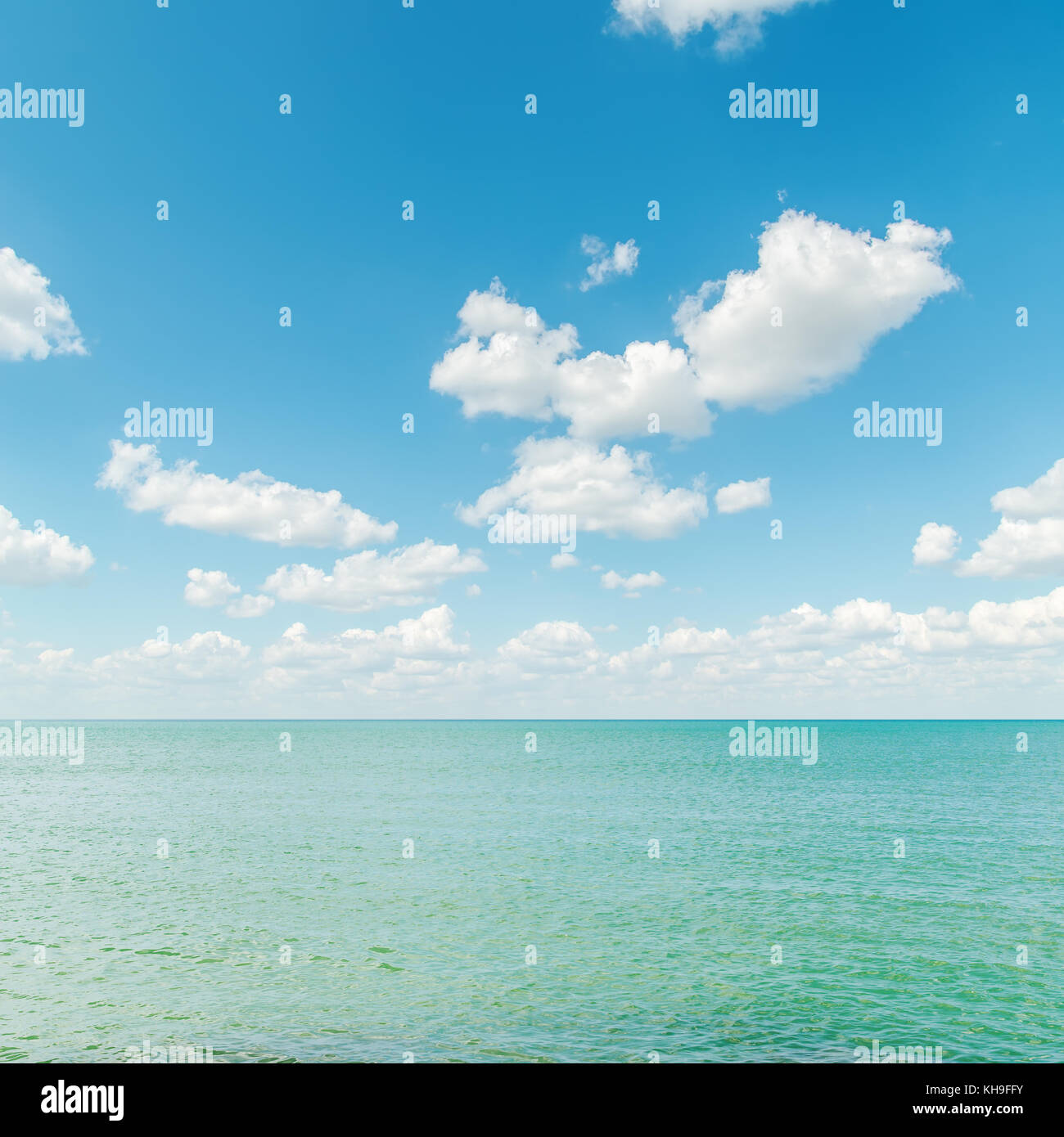 azure sea with blue cloudy sky Stock Photo - Alamy