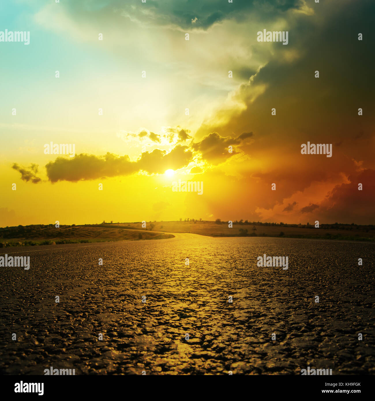 good sunset over asphalt road Stock Photo - Alamy