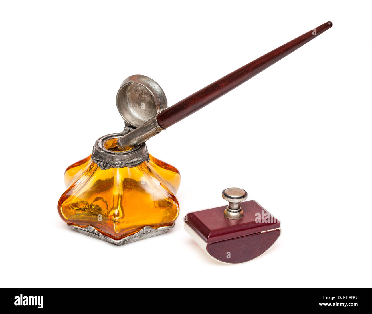 Vintage fountain pen and inkwell isolated on a white background with ...