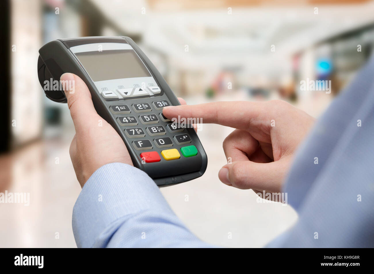 Hand using credit card payment machine. card machine terminal payment ...