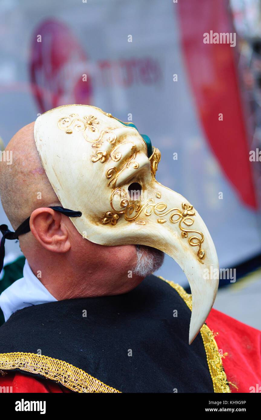 Closeup of a male performer wearing a mask on the Royal Mile during the ...