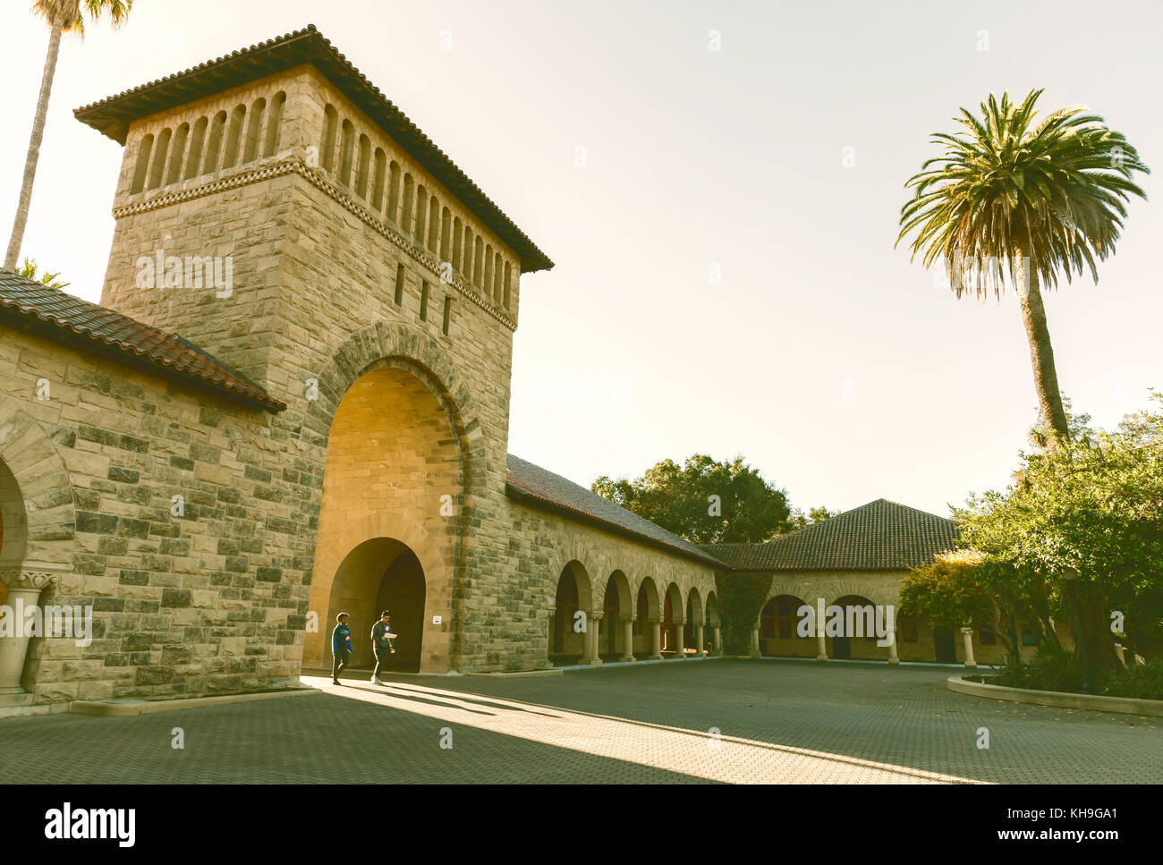 Two students walk through the arch tower, Stanford University, Palo ...