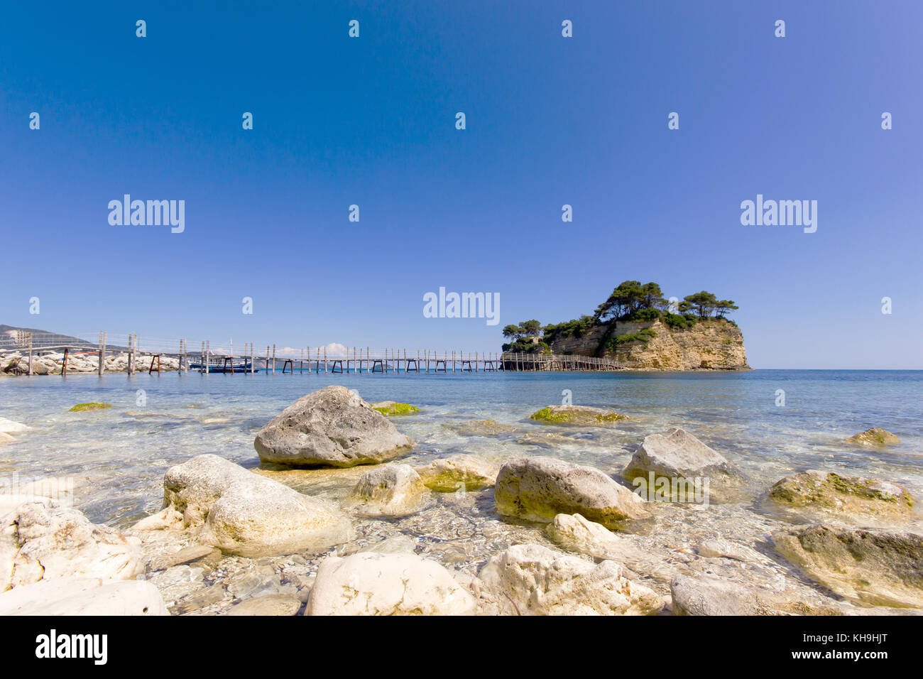 small island with wooden bridge that crossing the sea Stock Photo - Alamy