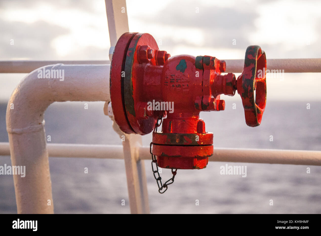 Red steel valve on a cruise ship Stock Photo - Alamy