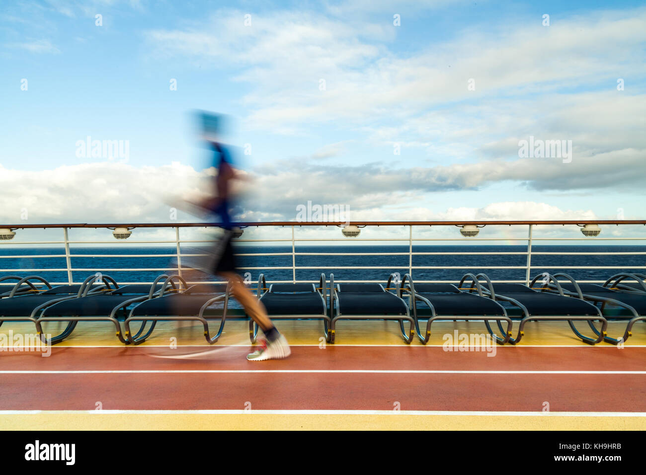 Blurred Joggers on cruise ship running track Stock Photo - Alamy