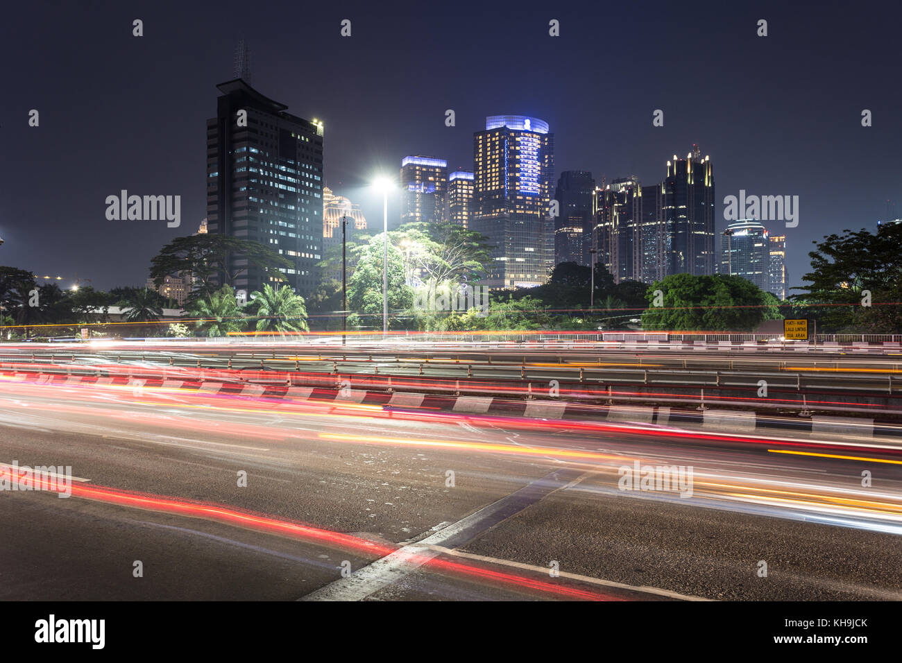 Traffic captured with blurred motion rushing along the Gatot Subroto ...