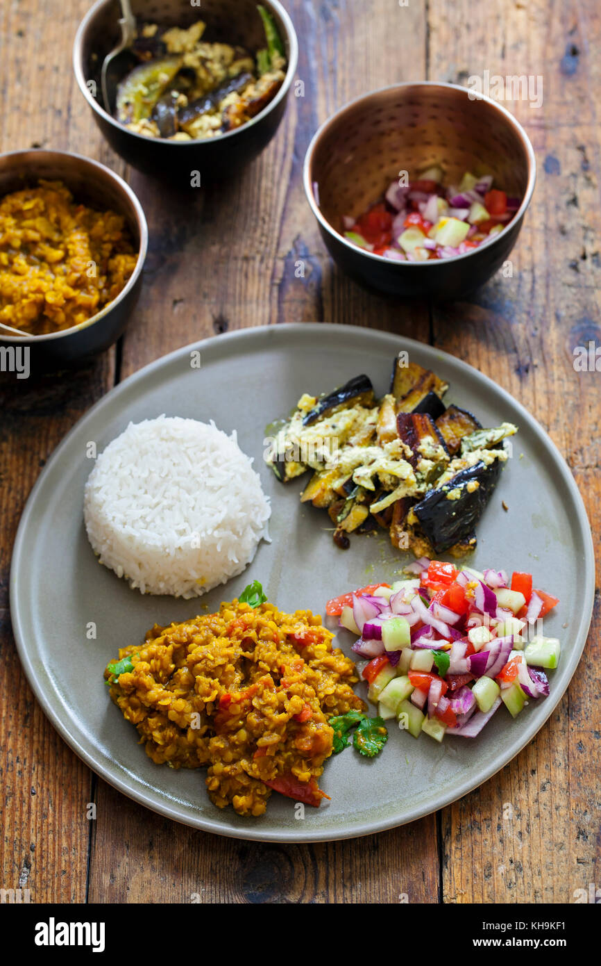 Indian meal with masoor dal - lentil curry, dahi baingan, rice and ...