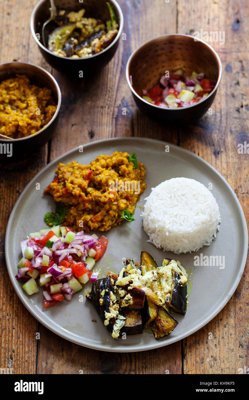 Indian meal with masoor dal - lentil curry, dahi baingan, rice and ...