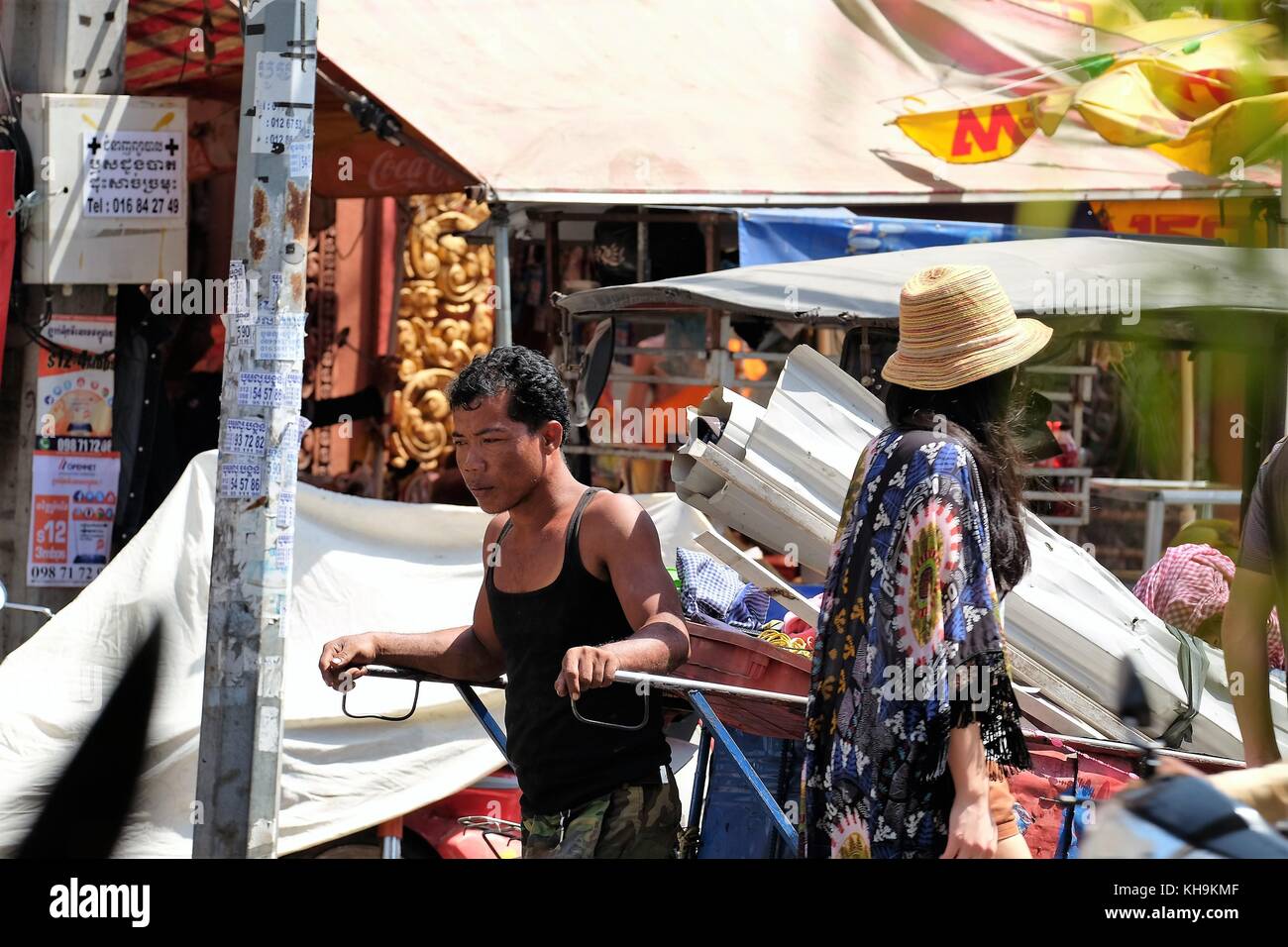 man pulling cart Stock Photo - Alamy