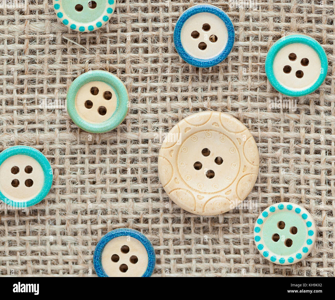 Wooden buttons on fabric Stock Photo - Alamy
