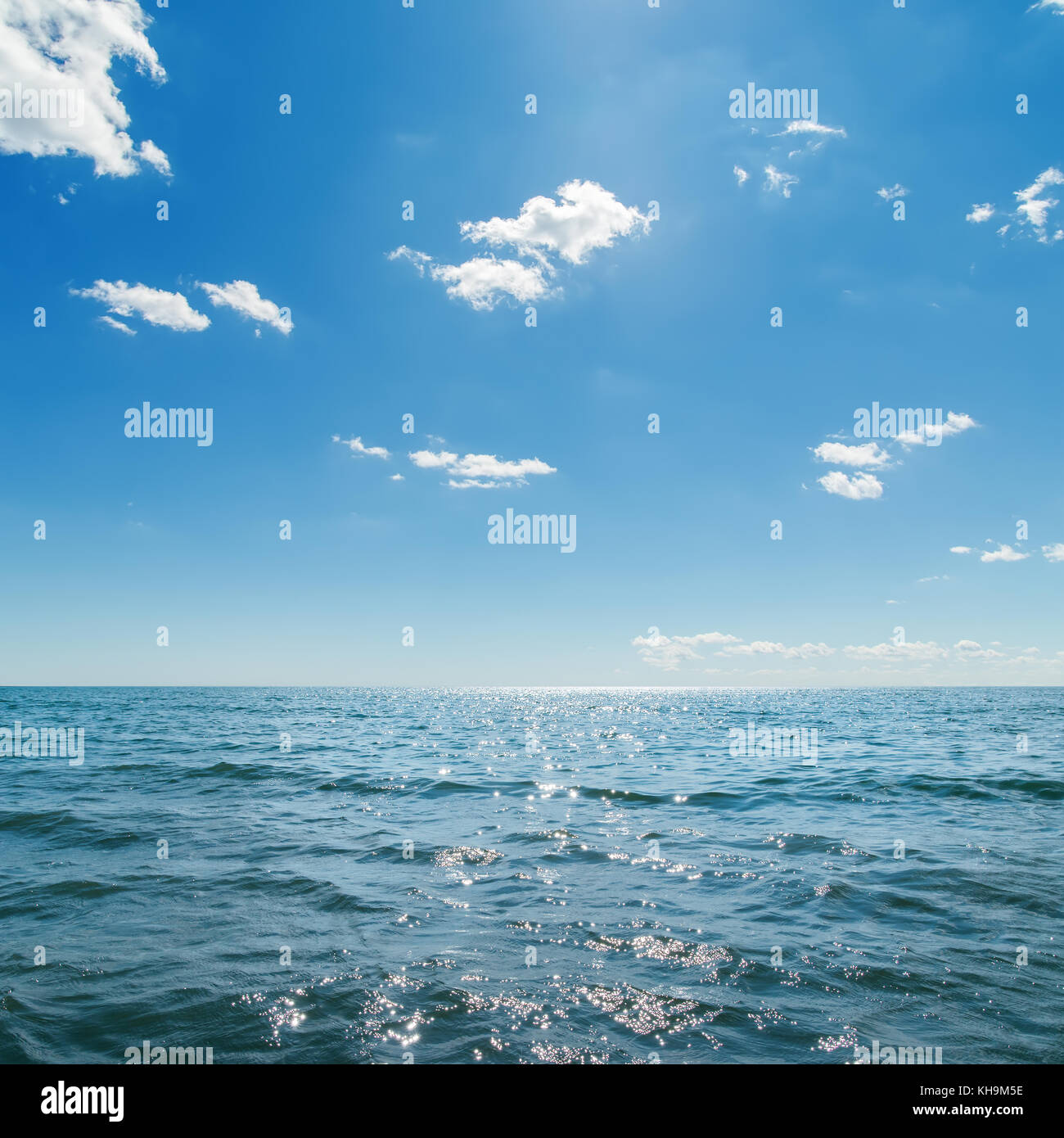 dark blue sea and deep blue sky with clouds Stock Photo - Alamy