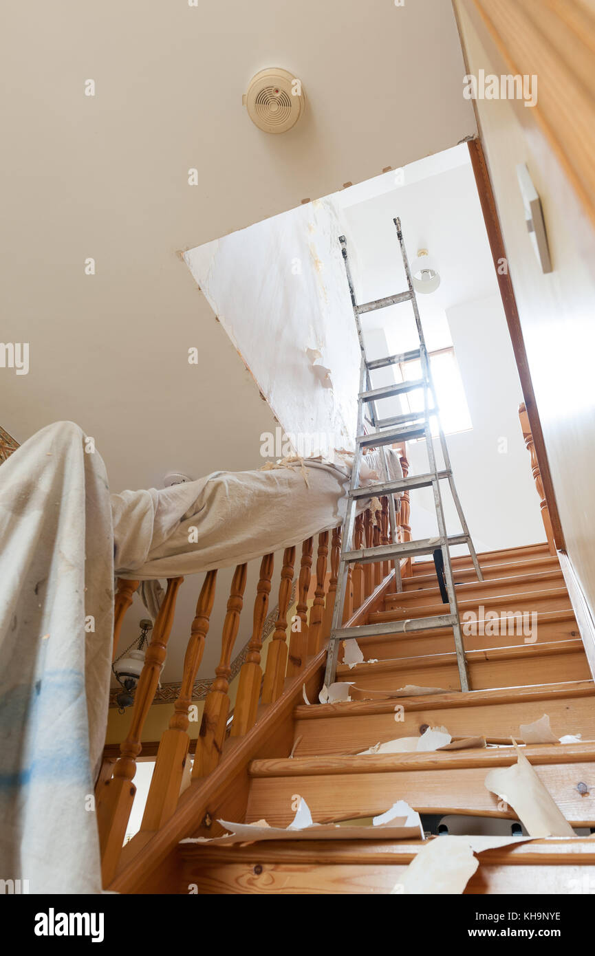 Dangerous tricky position decorating stripping on home stairs on a ...