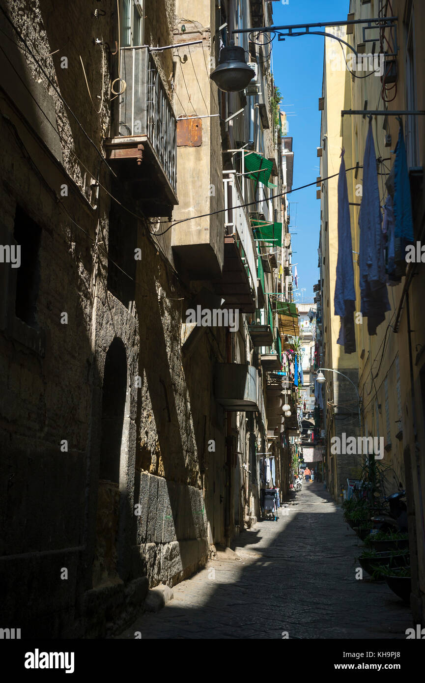 View of dark shady alley of Naples' historic center Stock Photo - Alamy