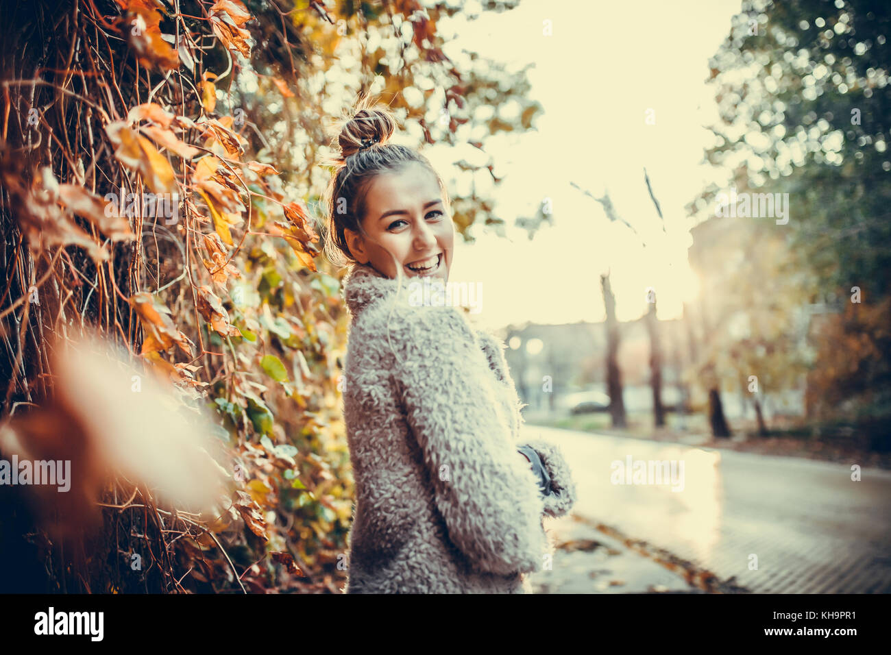 Portrait of a beautiful urban girl on the street with a background of ...