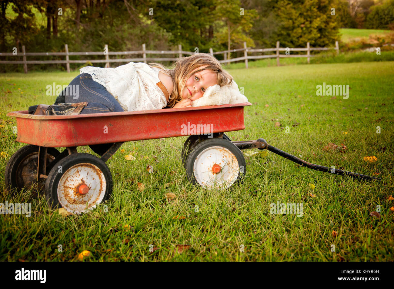 girl in red wagon Stock Photo - Alamy