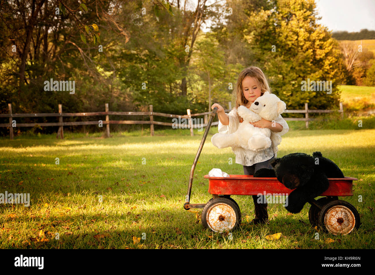 girl in red wagon Stock Photo - Alamy