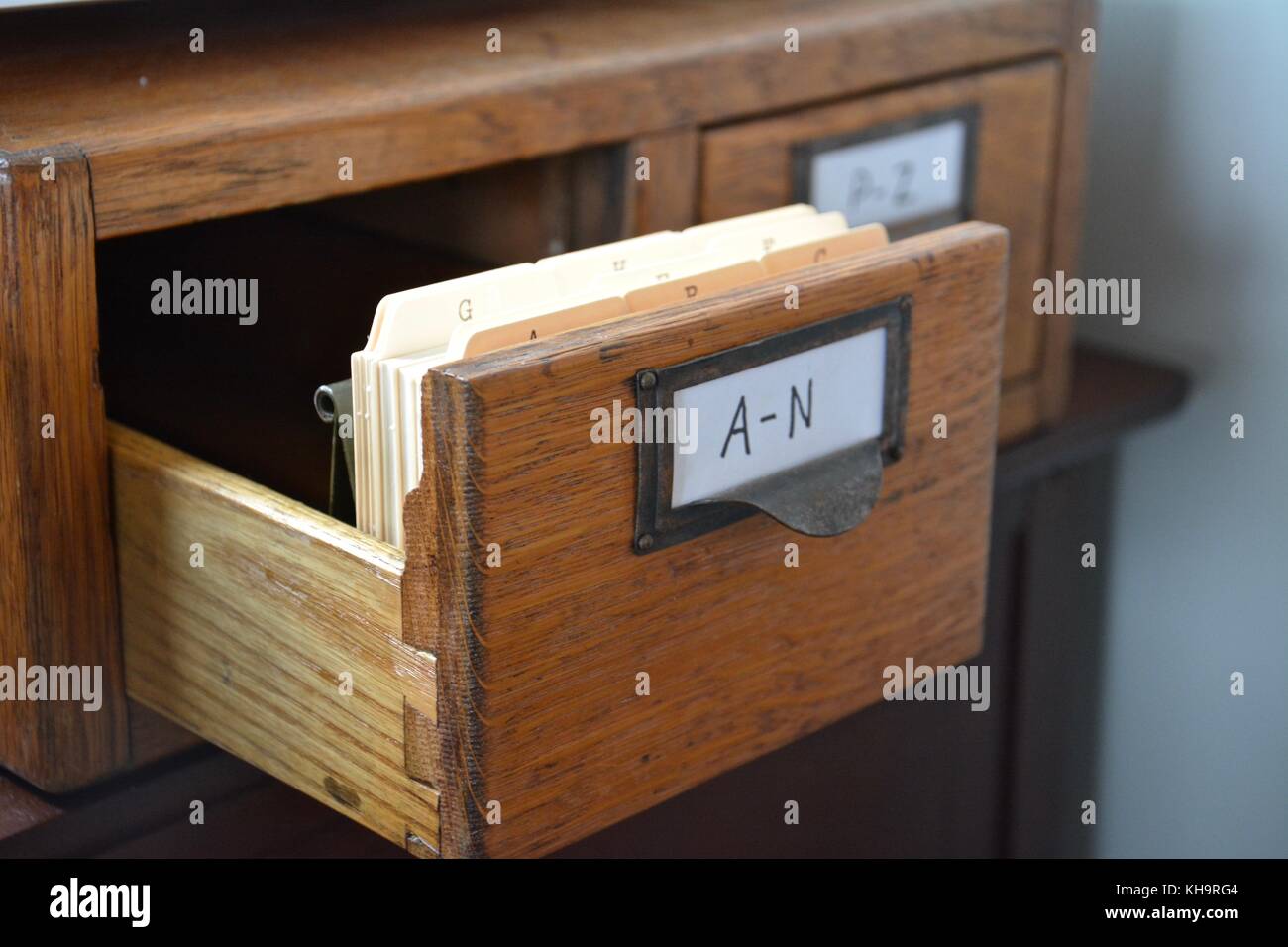A handwritten antique person library paper and wooden card catalog ...