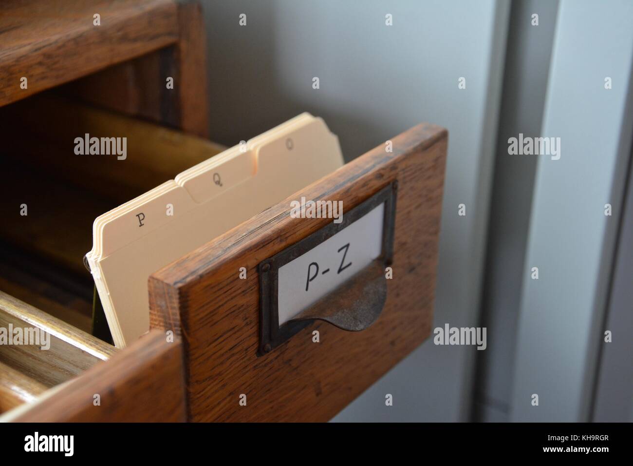 A handwritten antique person library paper and wooden card catalog ...