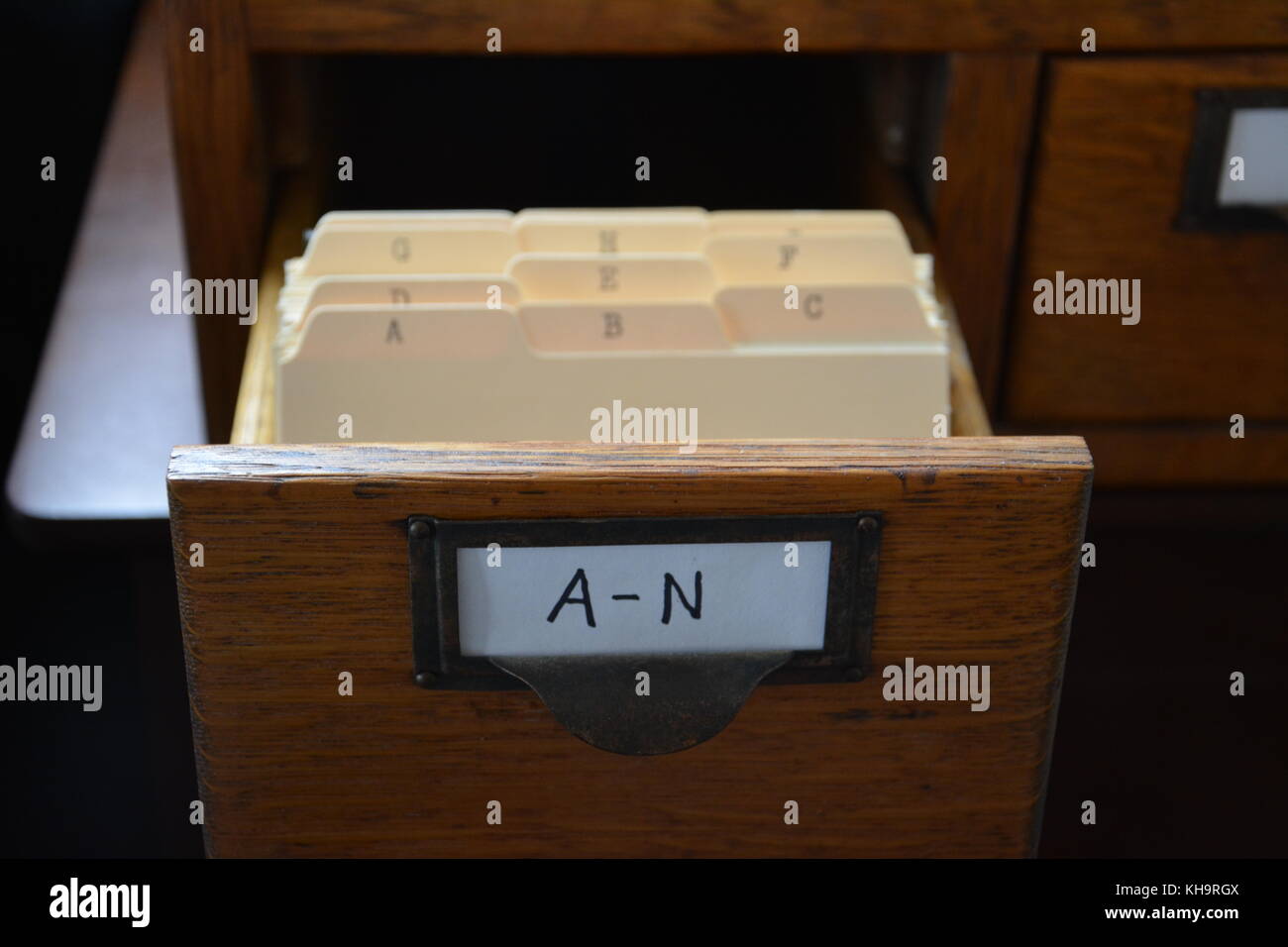 A handwritten antique person library paper and wooden card catalog ...