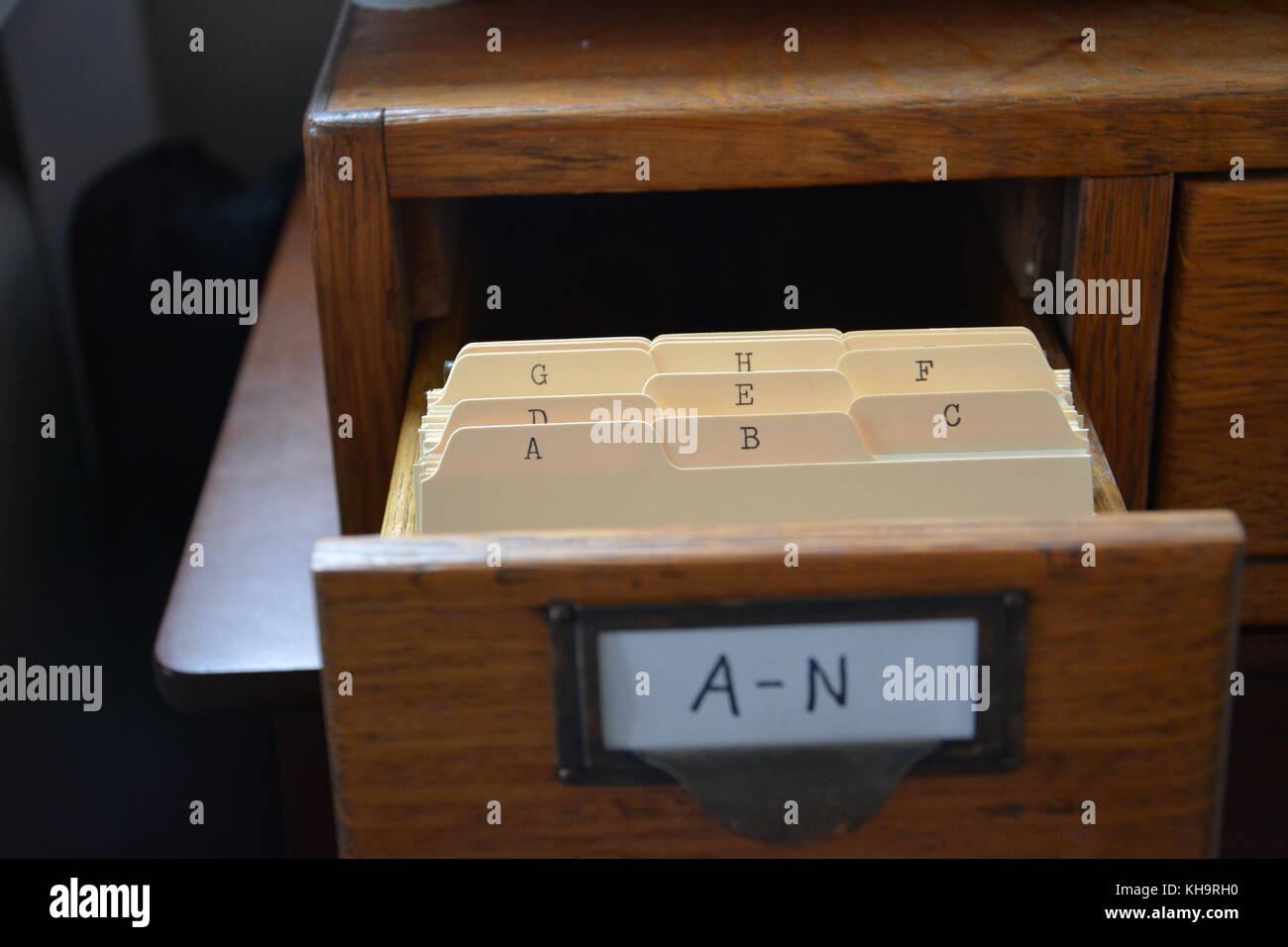 A handwritten antique person library paper and wooden card catalog ...