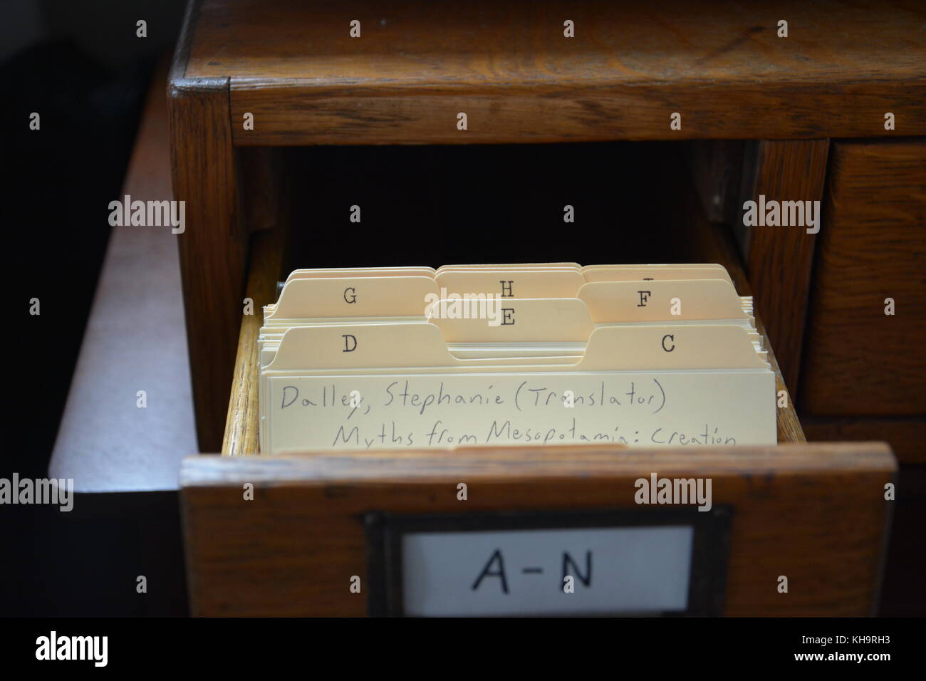 A handwritten antique person library paper and wooden card catalog ...
